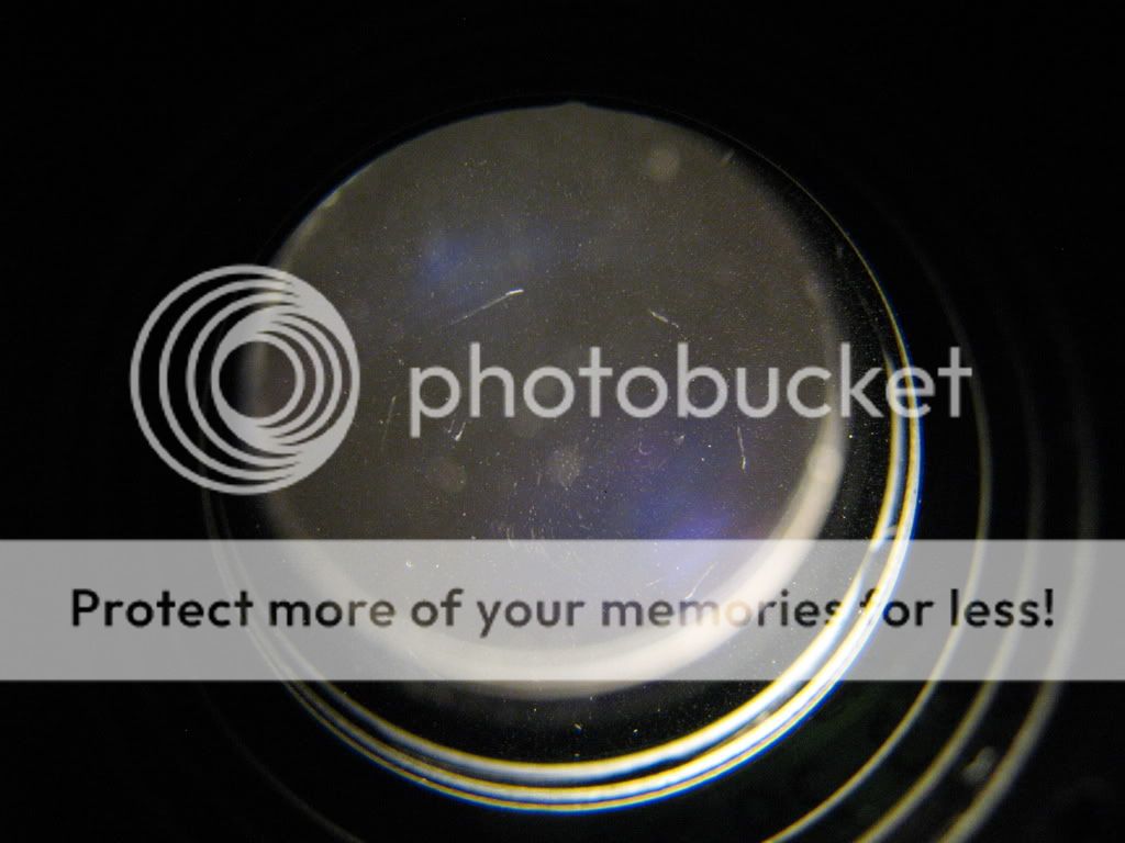 Speck of dust inside lens - Beginner Questions - Photo.net